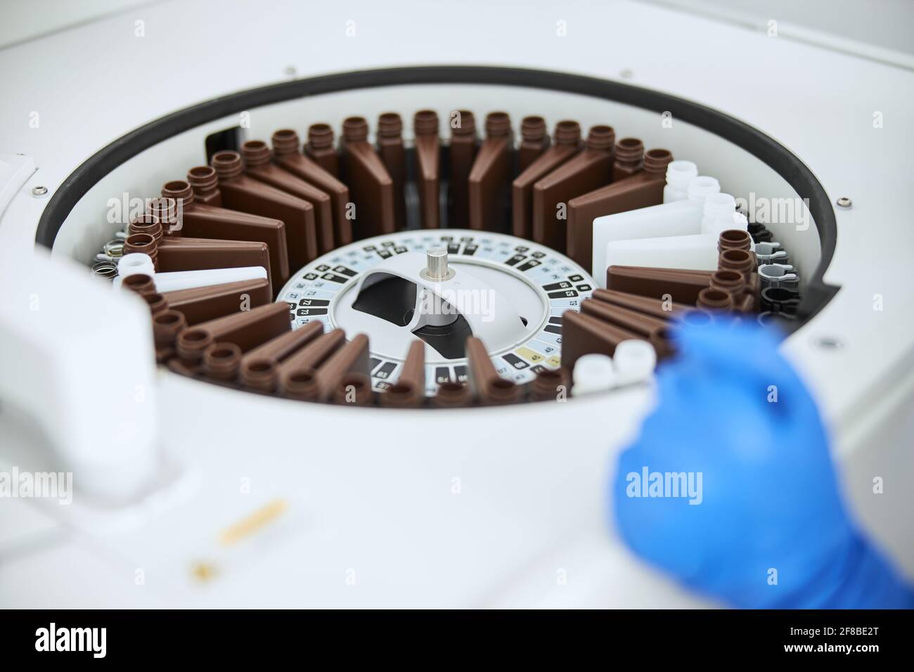 Lab worker and an open biochemistry analyzer Stock Photo - Alamy