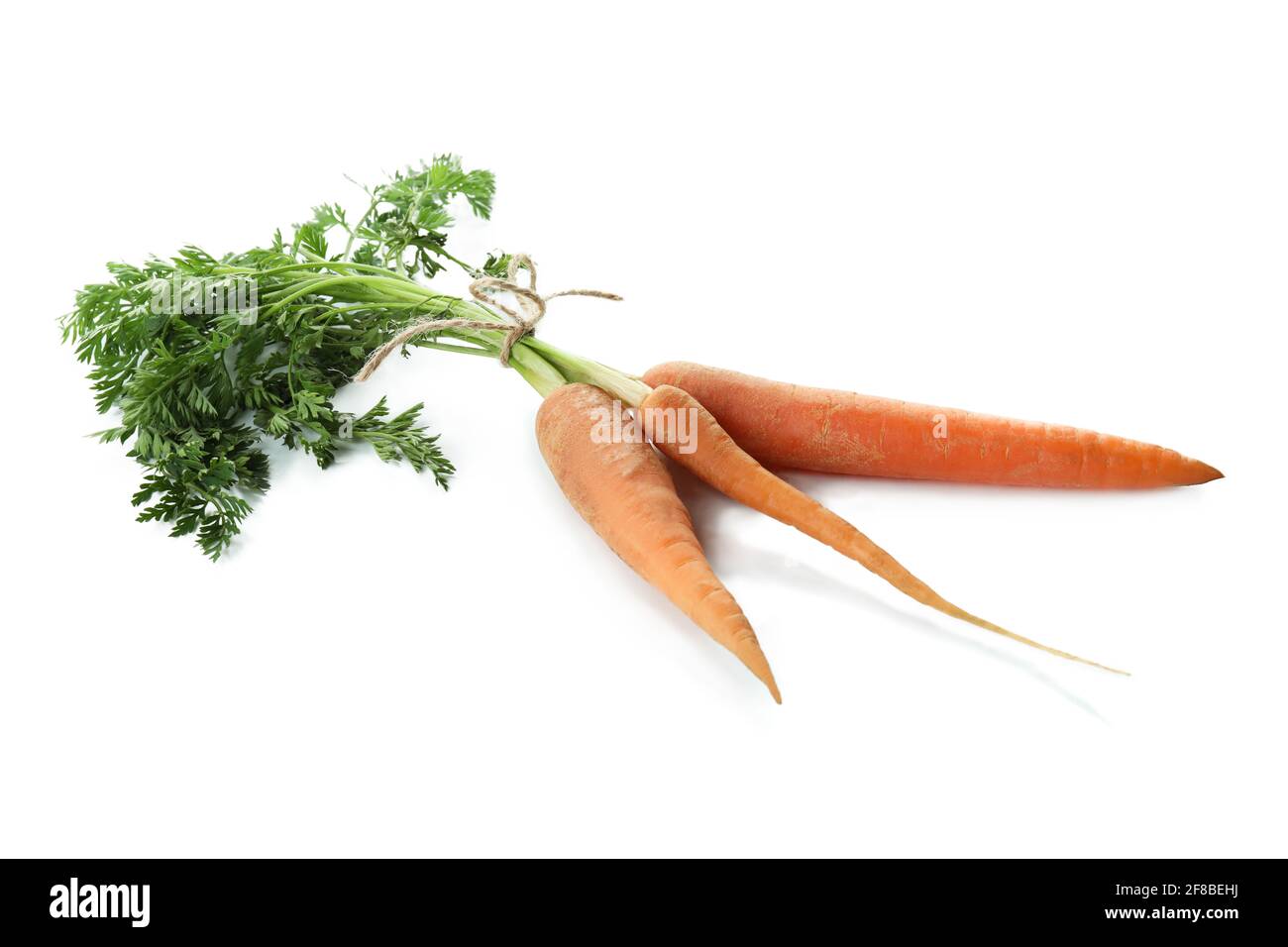 Fresh carrots tied with rope isolated on white background Stock Photo ...