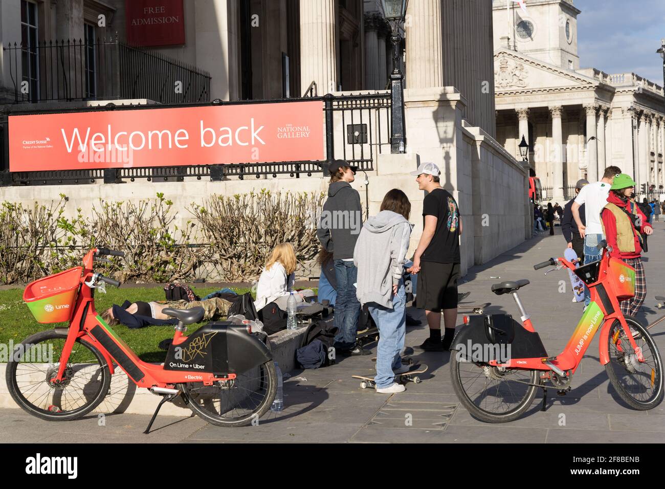 teenagers practise roller staking in front to National Gallery next to ...