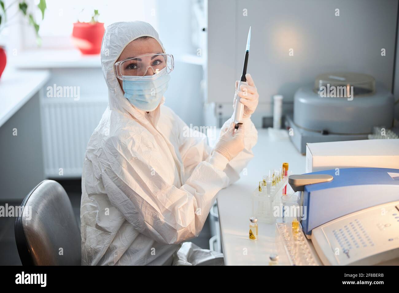 Virologist with the assembled lab tool looking ahead Stock Photo - Alamy