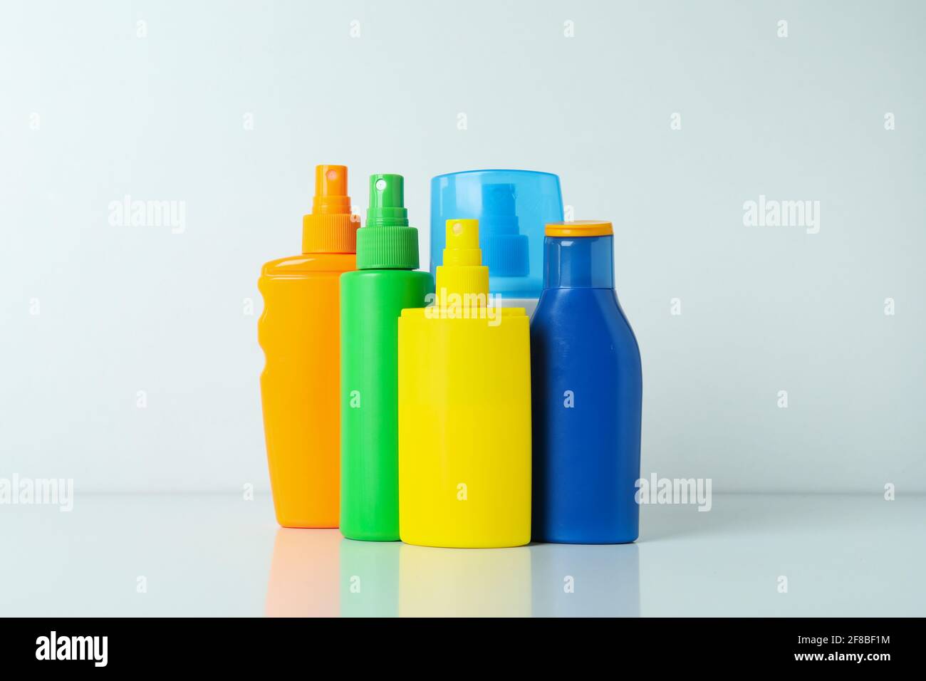 Blank bottles of sunscreen on white background Stock Photo - Alamy