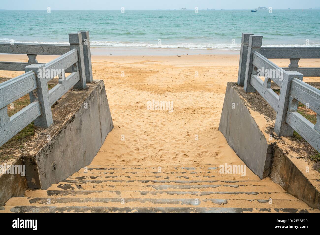 Stairs leading to beautiful Holiday Jiari beach and sea view in Haikou ...