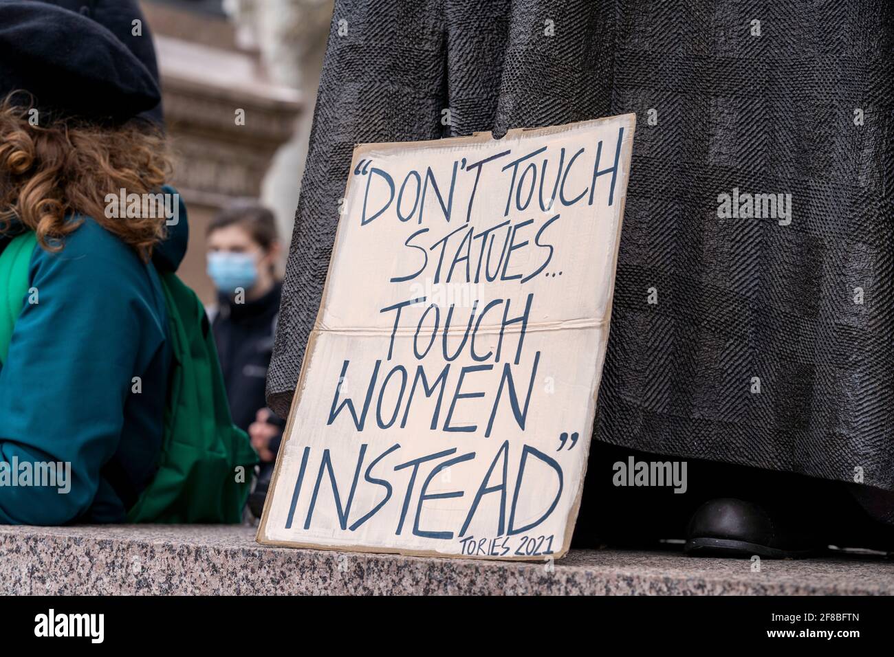 LONDON, UK - 03rd April 2021: Women’s Safety activist sign by a statue ...