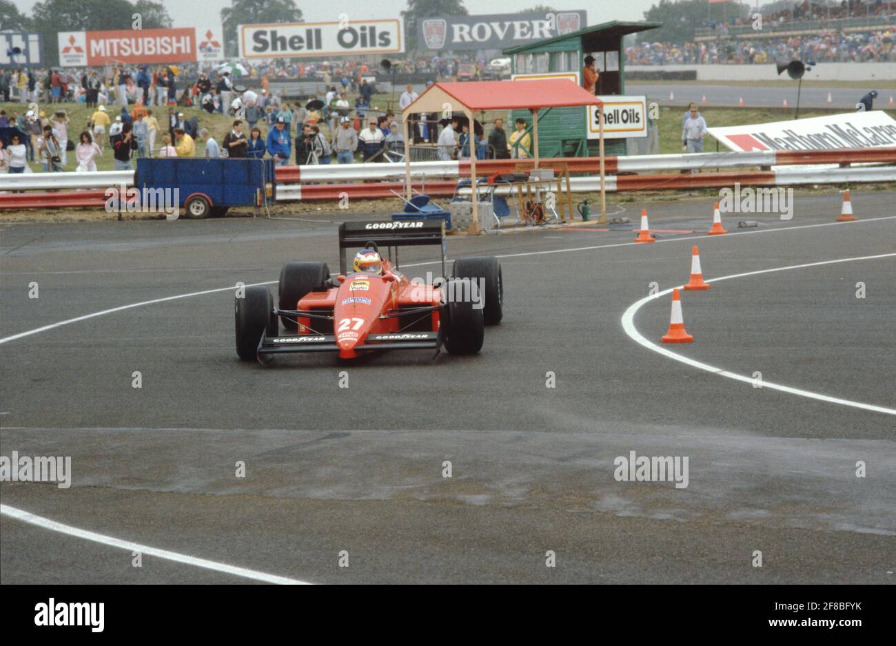 Michele Alboreto brings his Ferrari F186 into the pits during ...