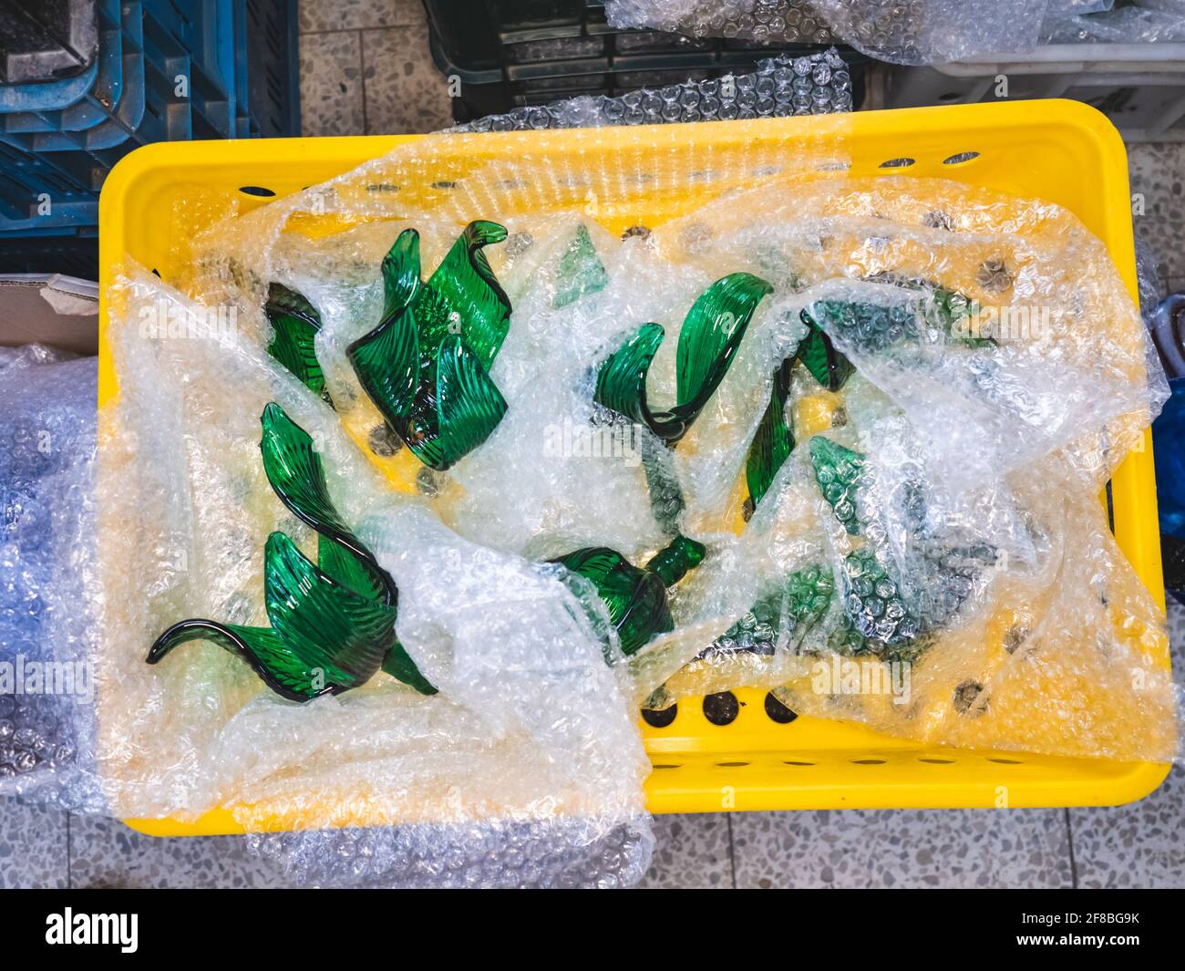 Packaging of glass art objects in a plastic carrier. Shipping and ...