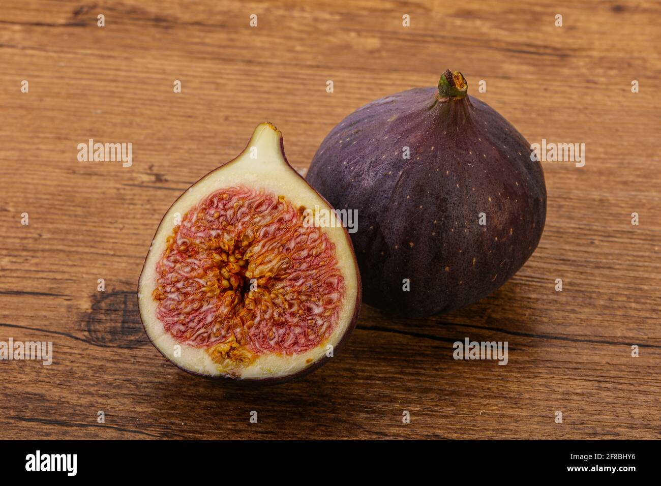 Sweet purple slice of fig fruit Stock Photo - Alamy