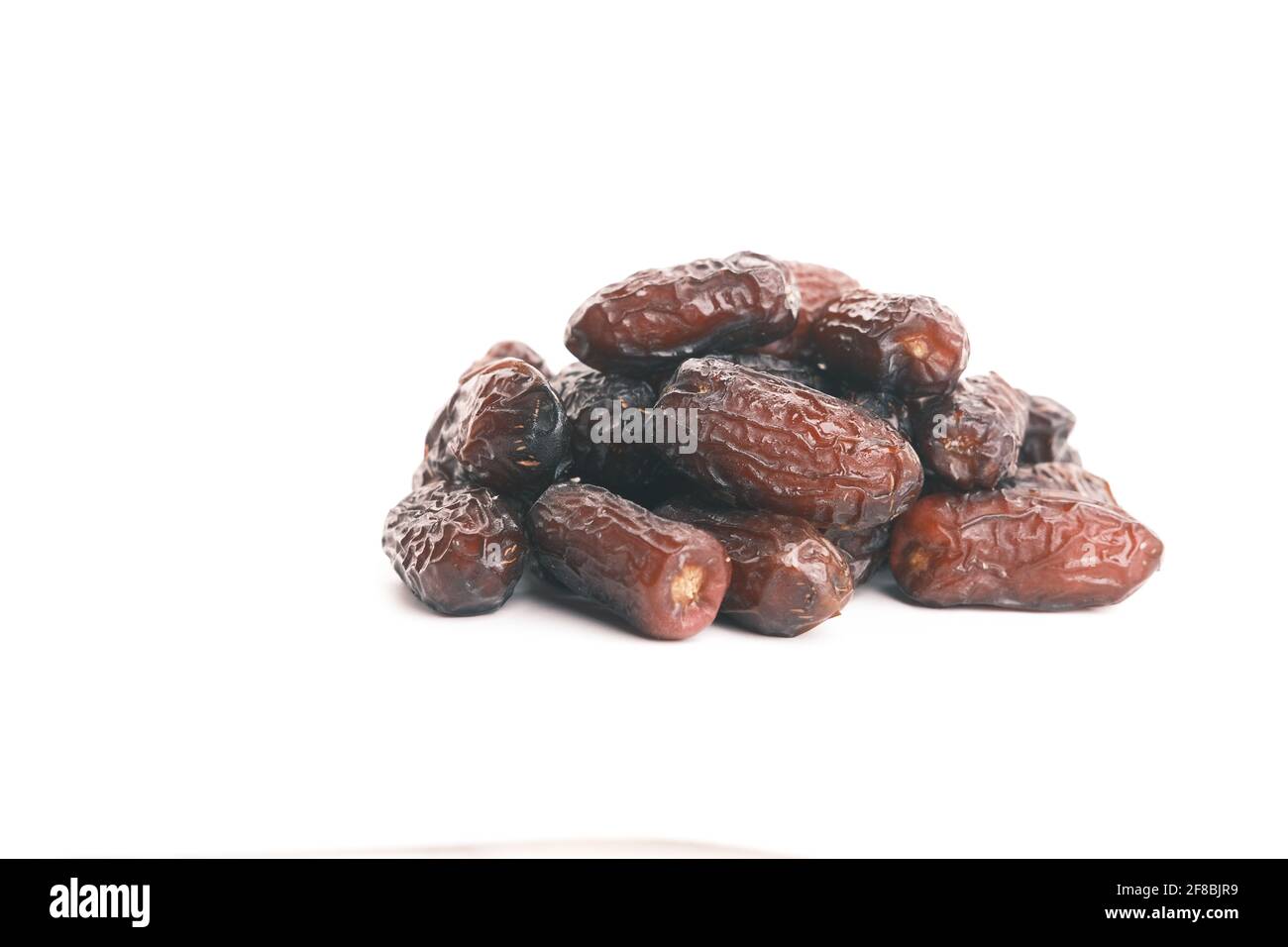 fresh date fruit isolated on white background Stock Photo - Alamy