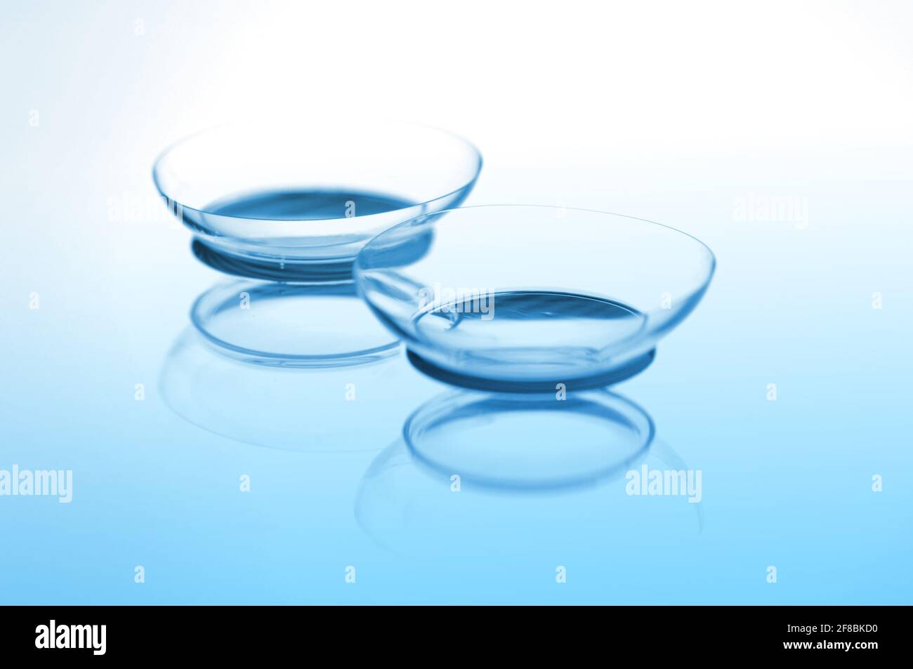 Contact lenses, on blue background Stock Photo - Alamy