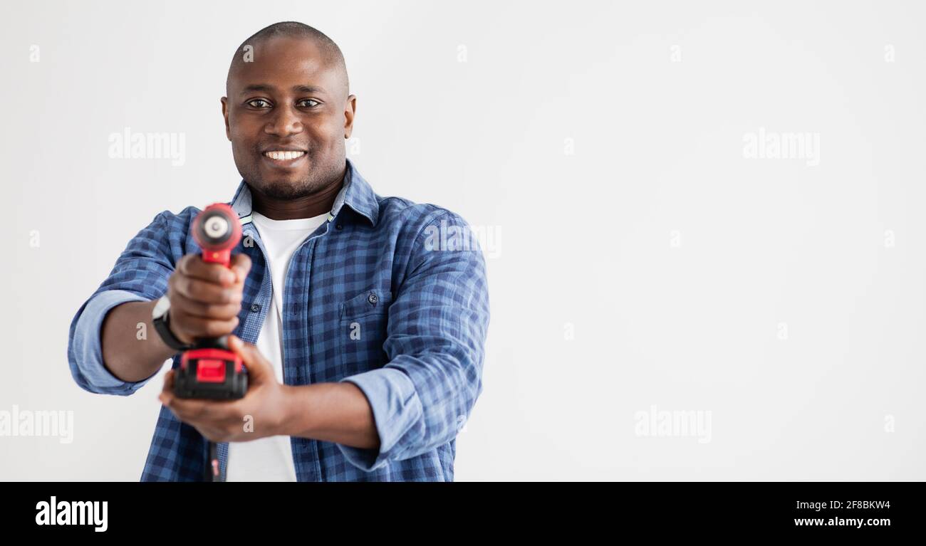 African american construction handyman holding hi-res stock photography ...
