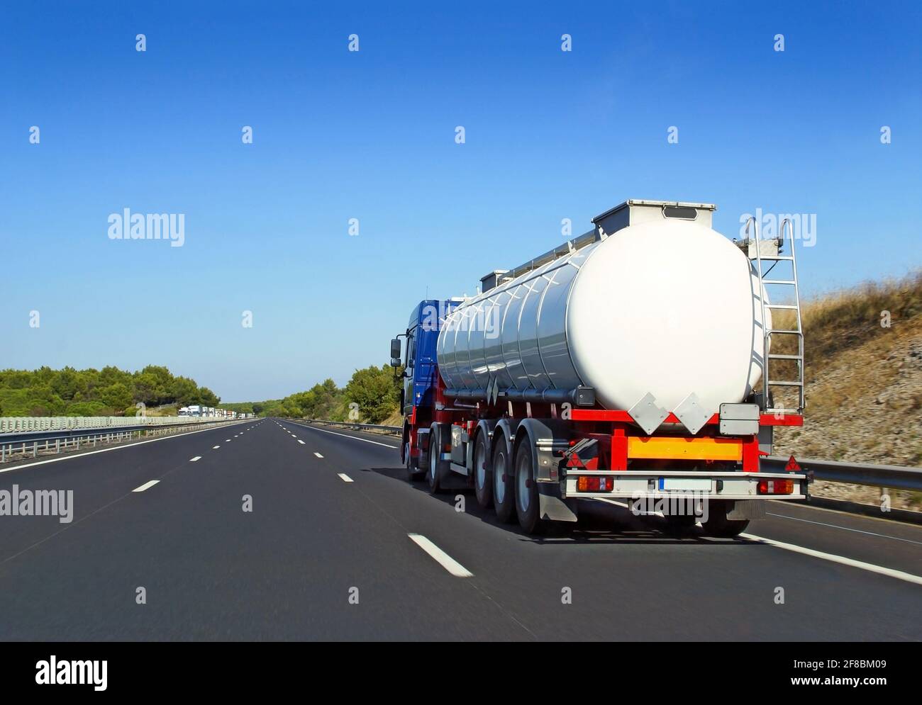 Highway transport by tanker truck Stock Photo - Alamy