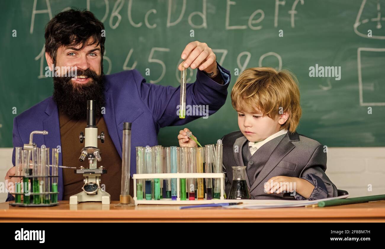 Welcome back to class. training room with blackboard. small boy with ...