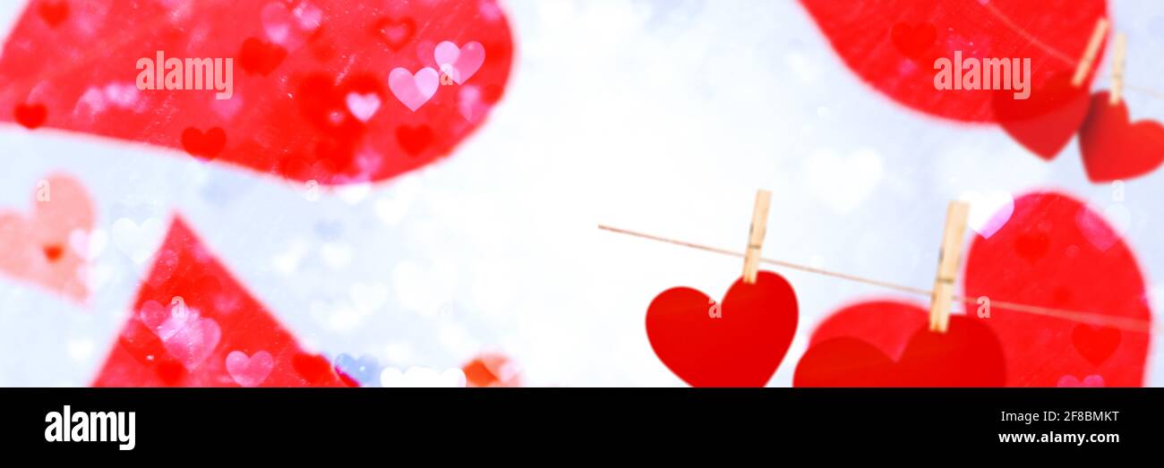 Red heart shapes on a string against white background Stock Photo - Alamy