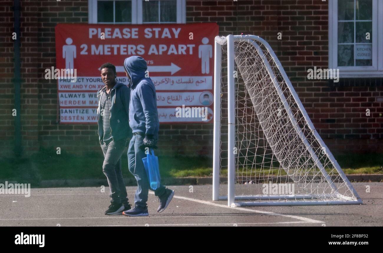 Men walk past signs hi-res stock photography and images - Alamy