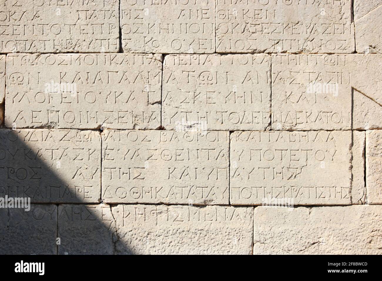 Old stone background with an ancient inscription Stock Photo - Alamy