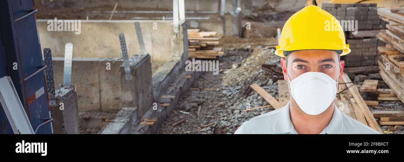 Caucasian male construction worker wearing mask and helmet ...