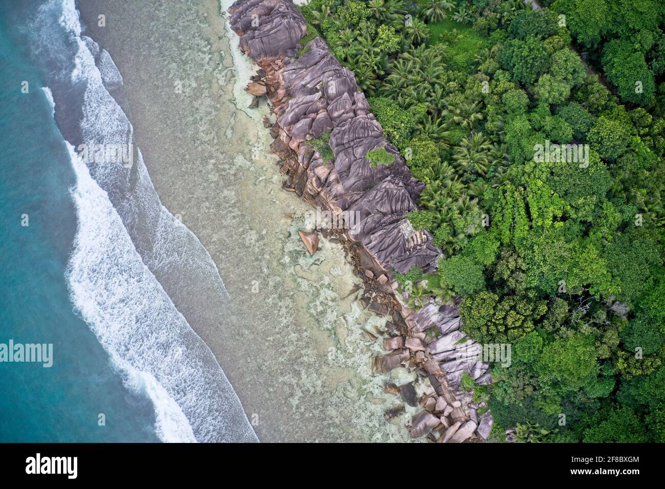 Aerial view of rocks, cliff and beach forming patterns in nature ...