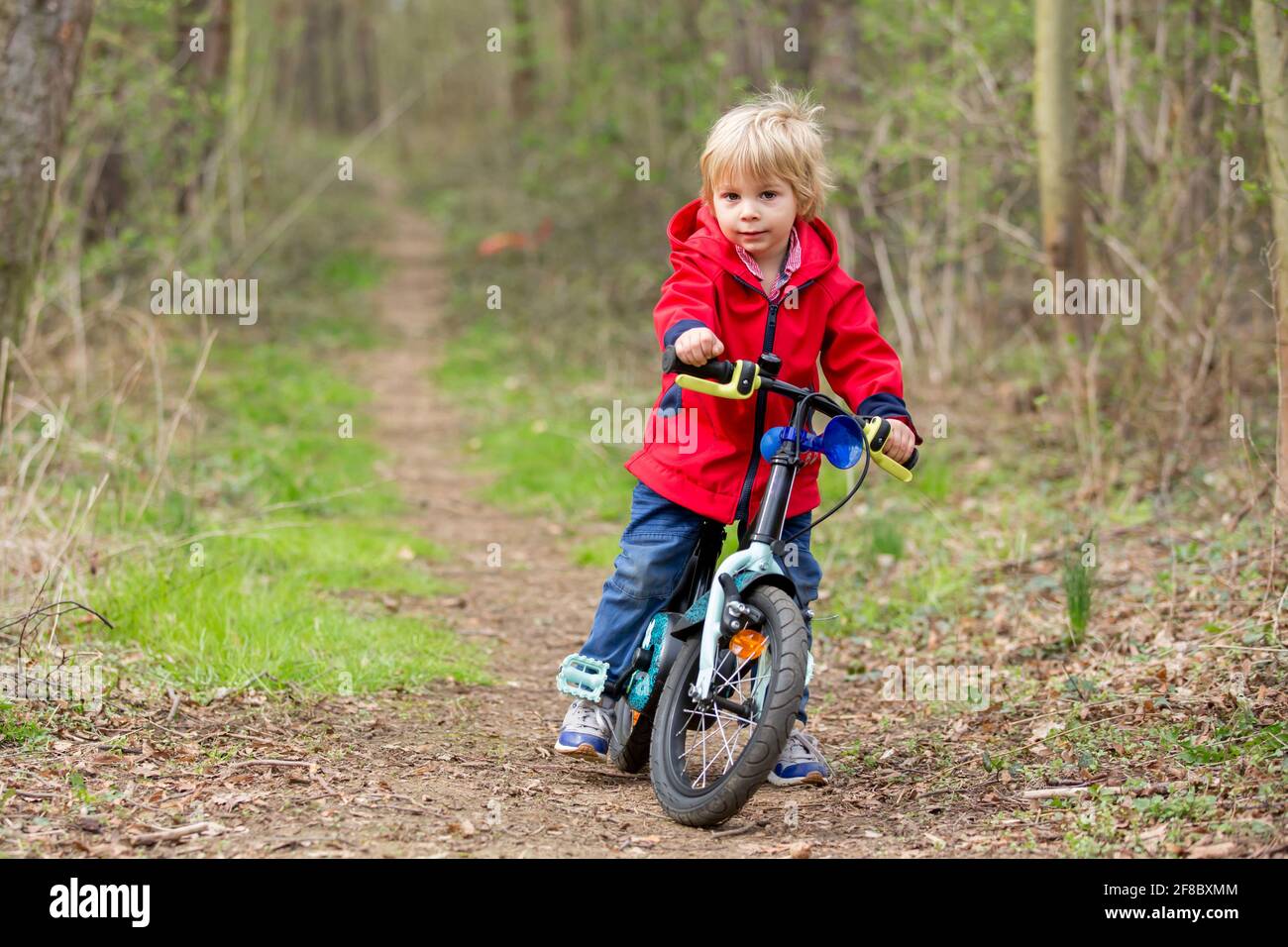 Father helping son ride a bike hi-res stock photography and images - Alamy