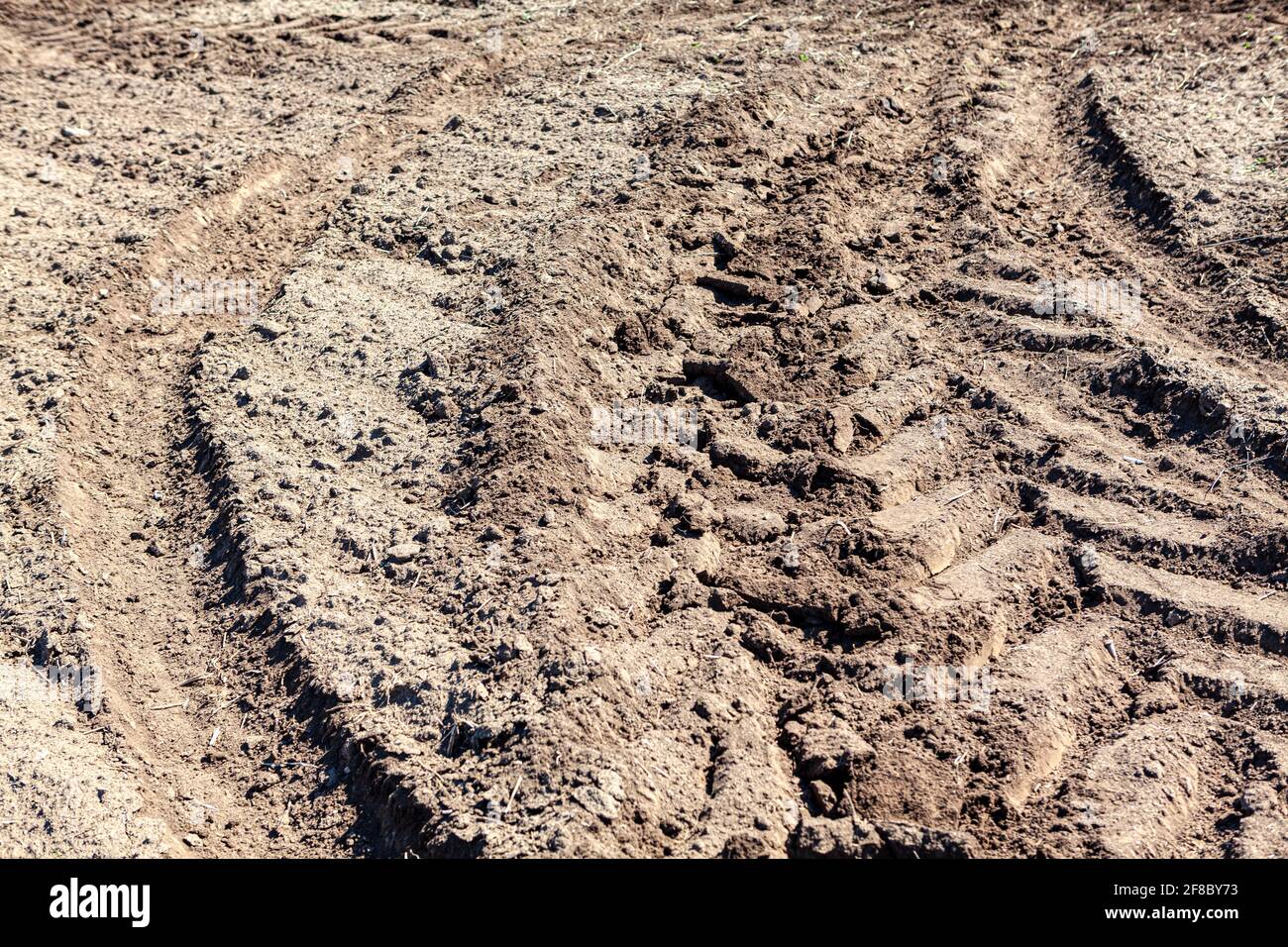 Tractor track on soil . Agricultural ground background Stock Photo - Alamy