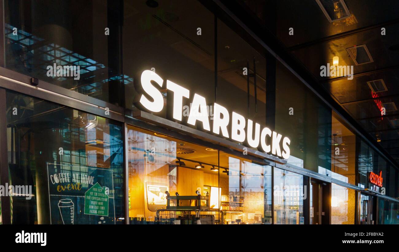 Germany , 13.04.2021 , Berlin , illuminated lettering Starbucks Stock ...