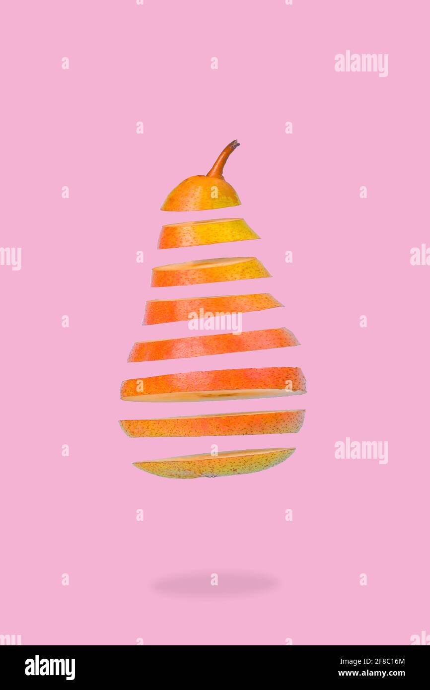 Minimal idea with Floating levitating ripe pear on pastel pink ...