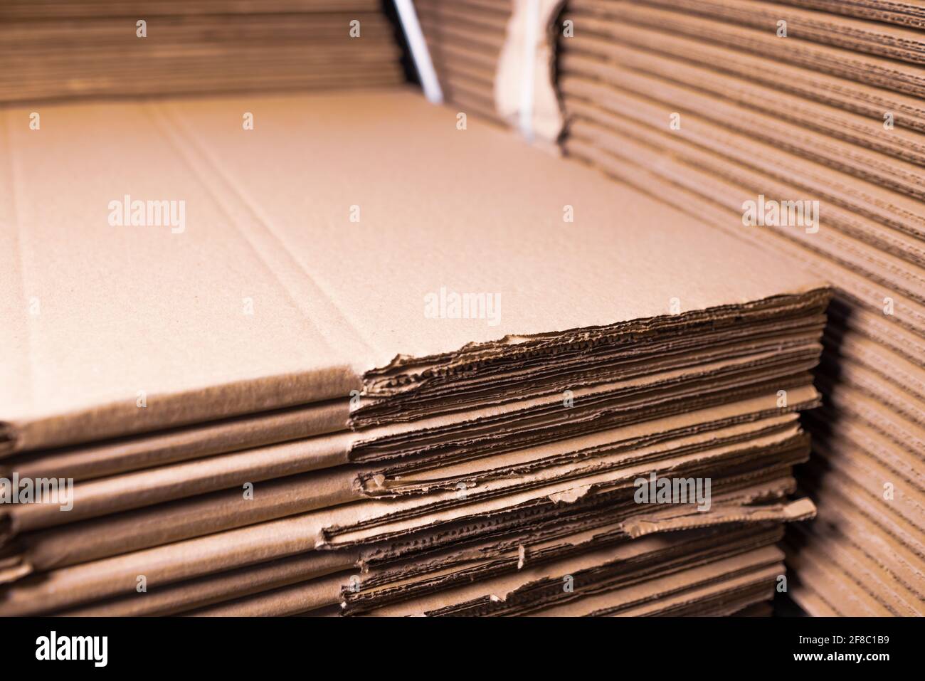 Close-up sides of stacks of cardboard folded Stock Photo - Alamy