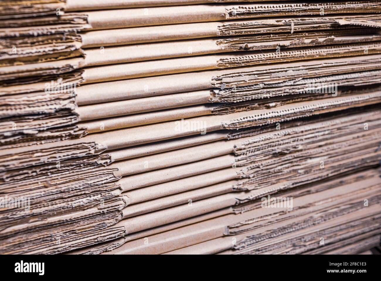 Close-up large cardboard piles lie on top Stock Photo - Alamy