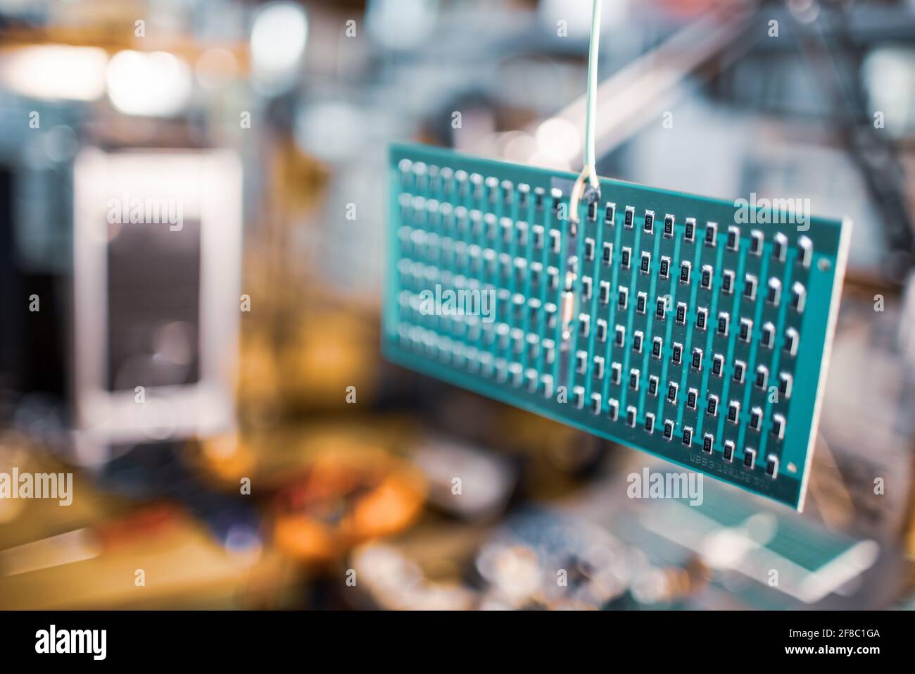 Microcircuits and components lie on metal plates Stock Photo - Alamy