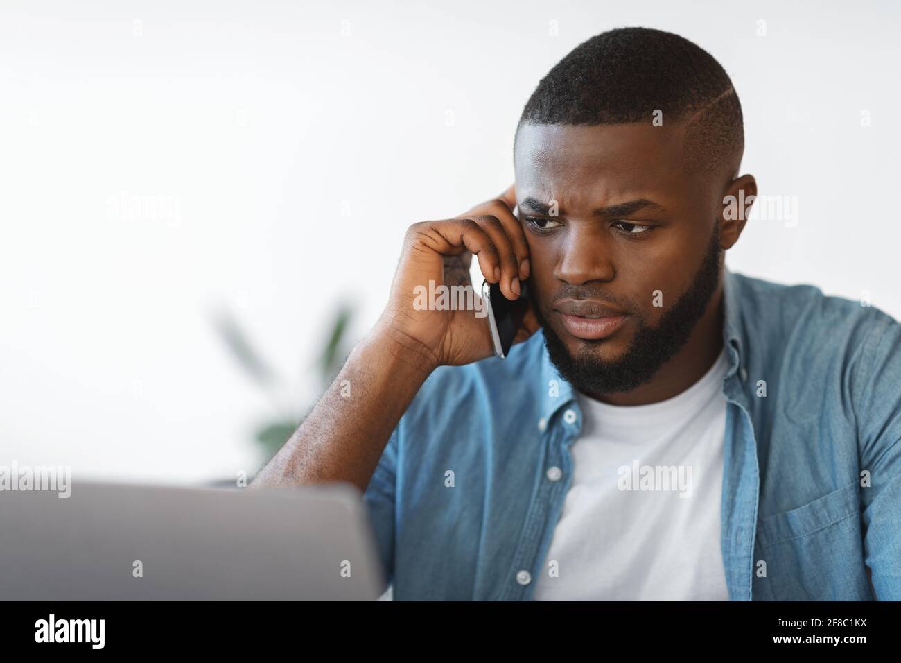 Focused busy african employee hi-res stock photography and images - Alamy