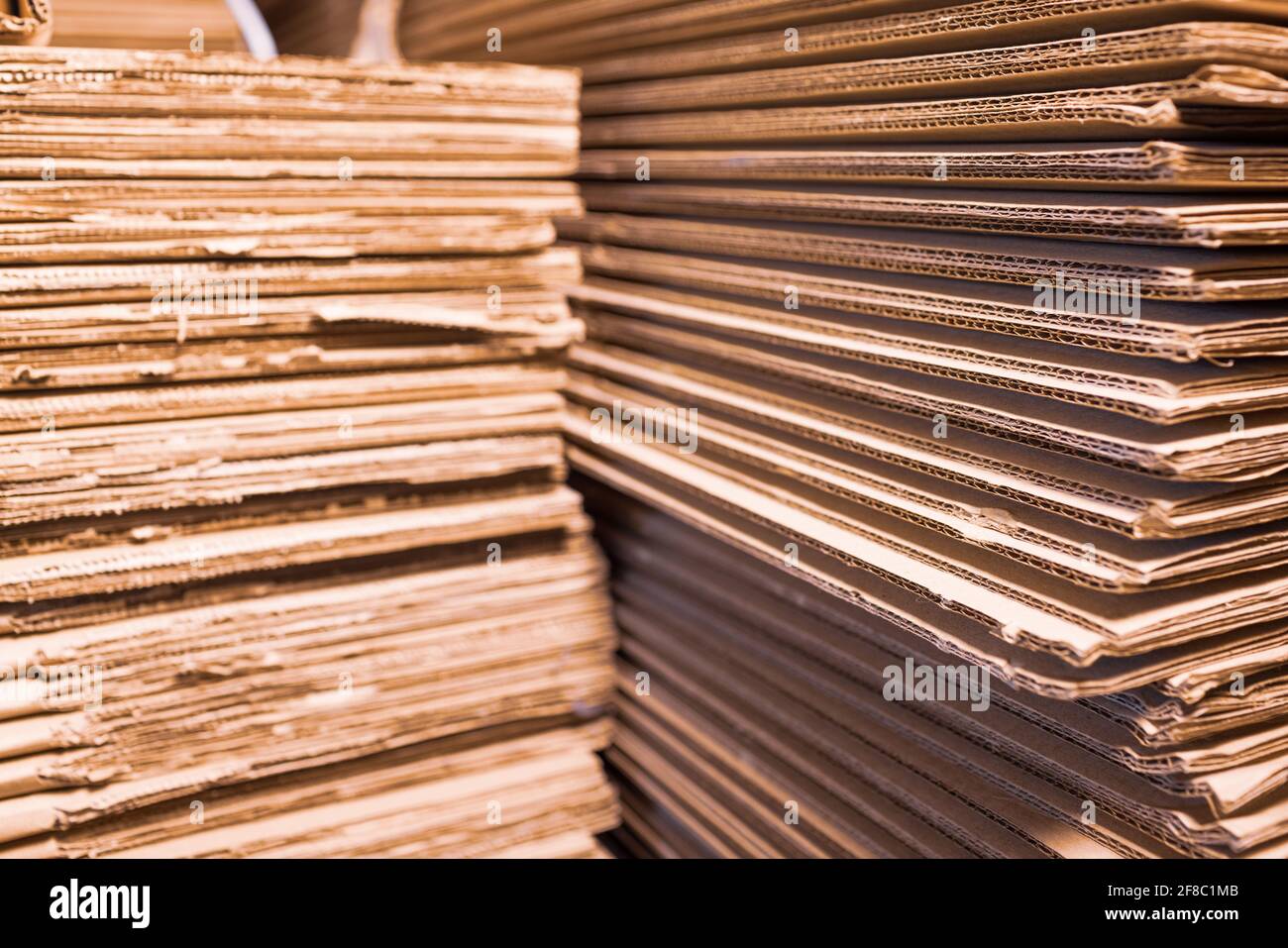 Close-up large cardboard piles lie on top Stock Photo - Alamy