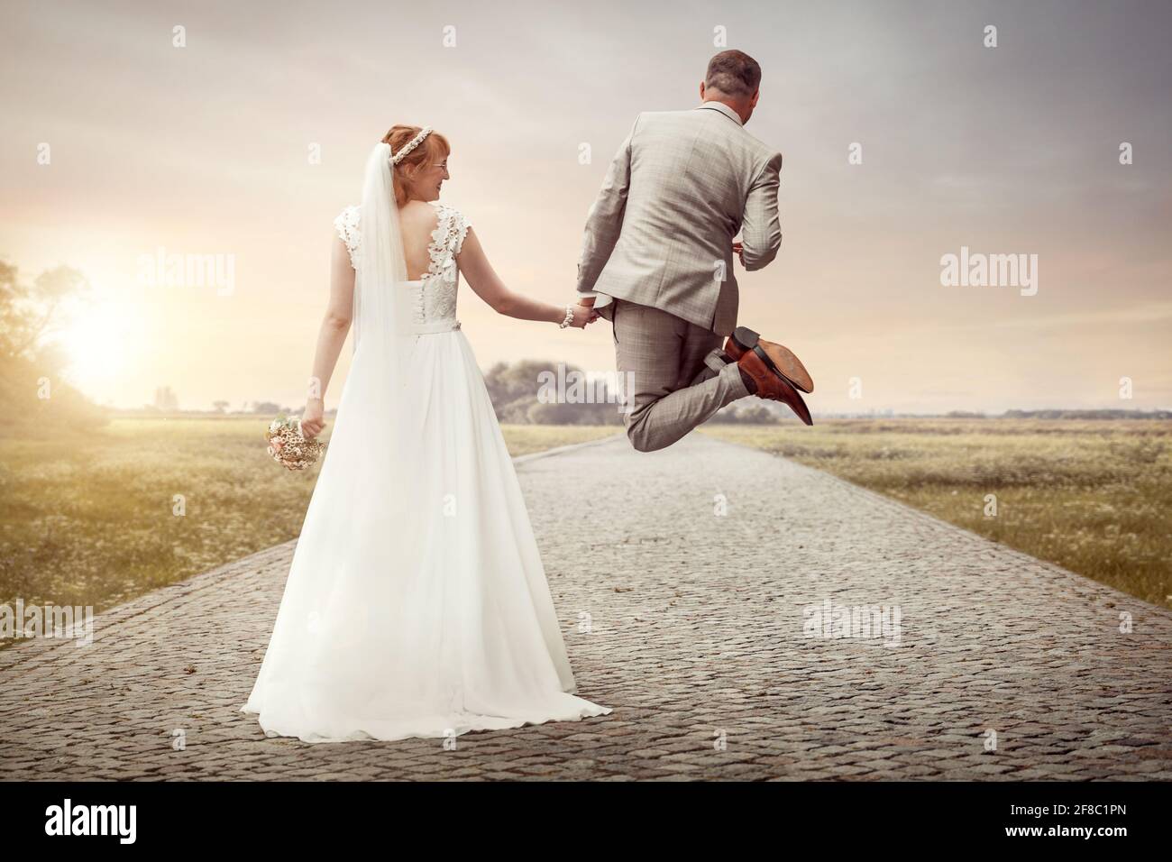 Bridal couple having fun on their wedding day Stock Photo - Alamy