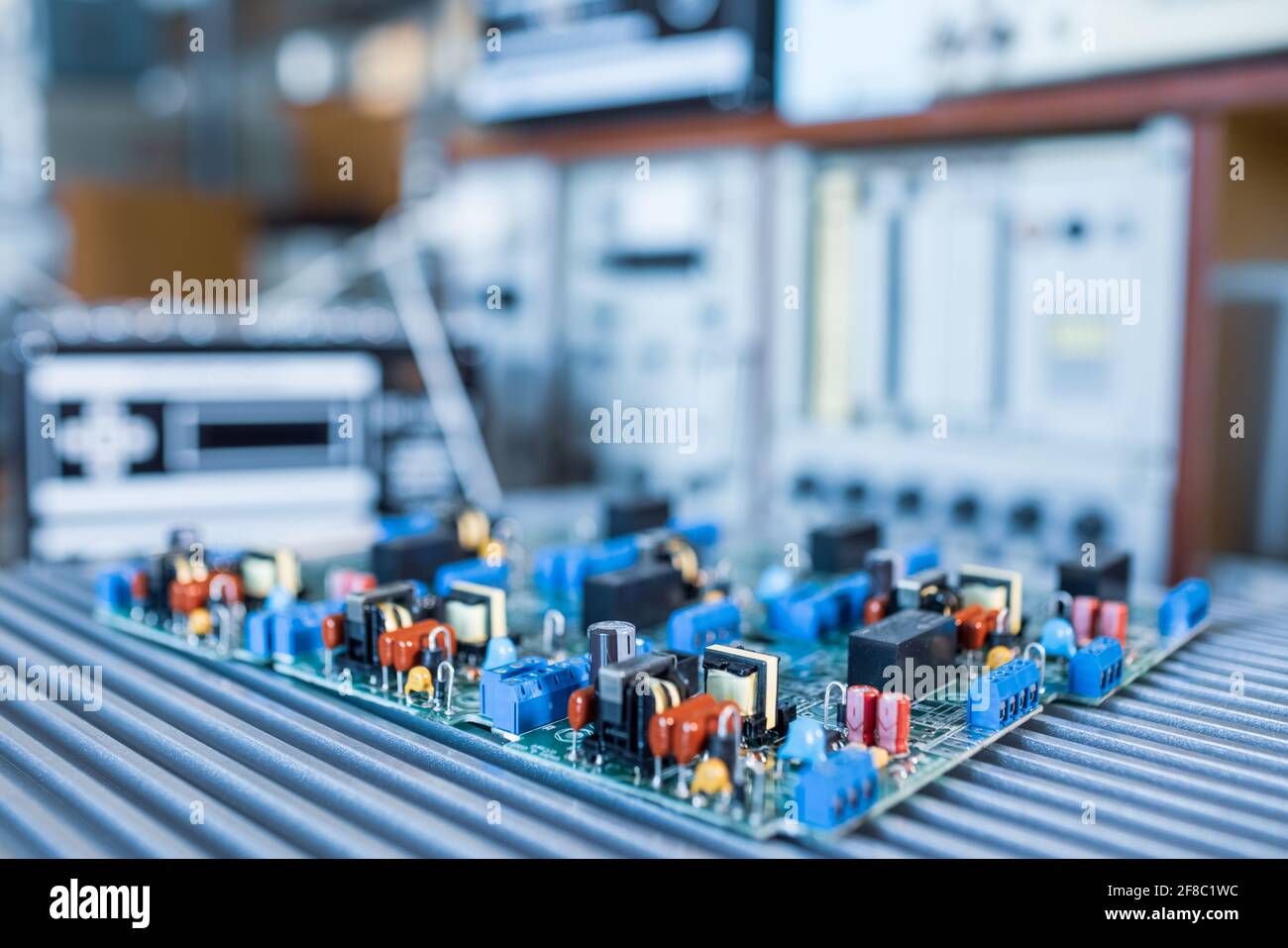 Microcircuits and components lie on metal plates Stock Photo - Alamy