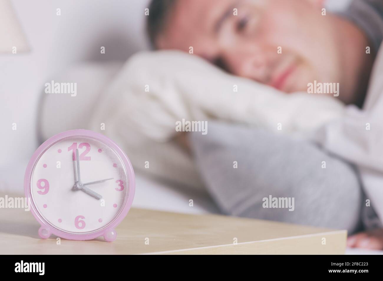Sleeping disorder insomnia concept clock hi-res stock photography and ...