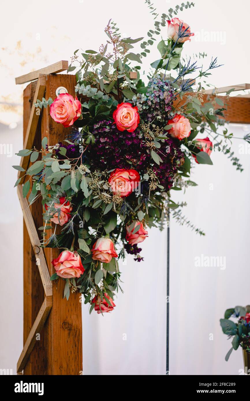 Corner wreath of wedding orange flowers at outdoor reception Stock ...