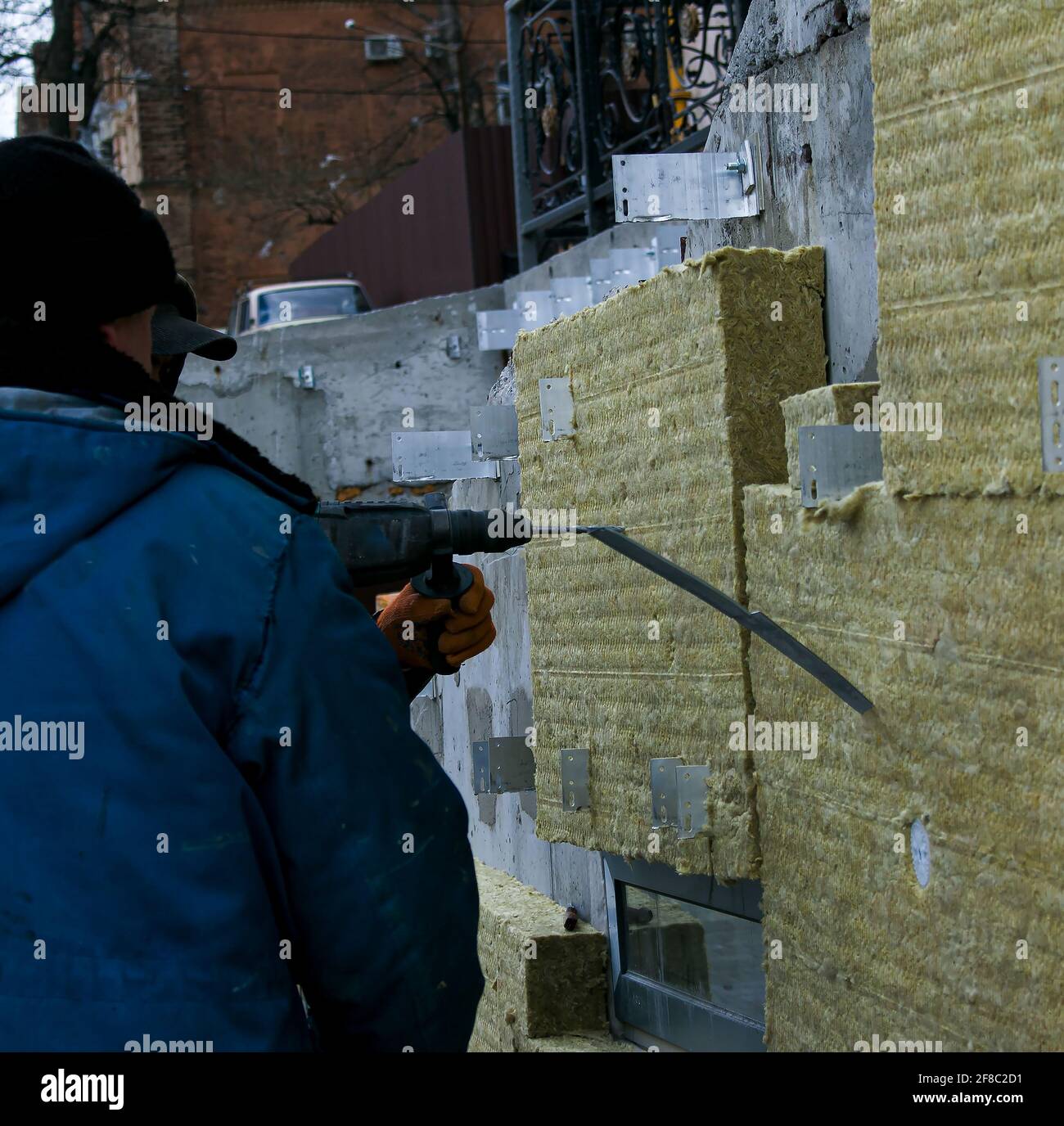 Installing fiberglass insulation hi-res stock photography and images ...