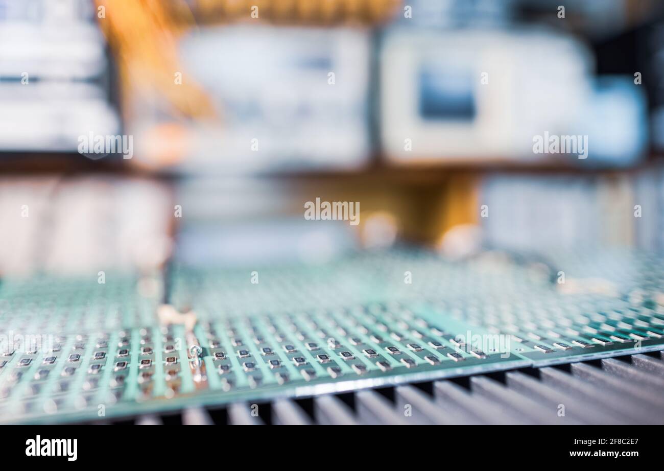Microcircuits and components lie on metal plates Stock Photo - Alamy