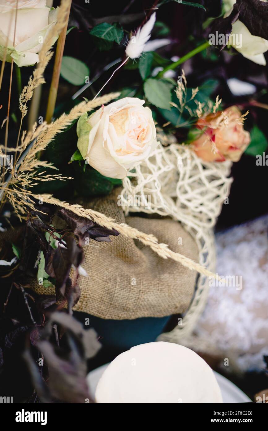 Closeup detail shot of elegant rustic wedding bouquet and reception ...