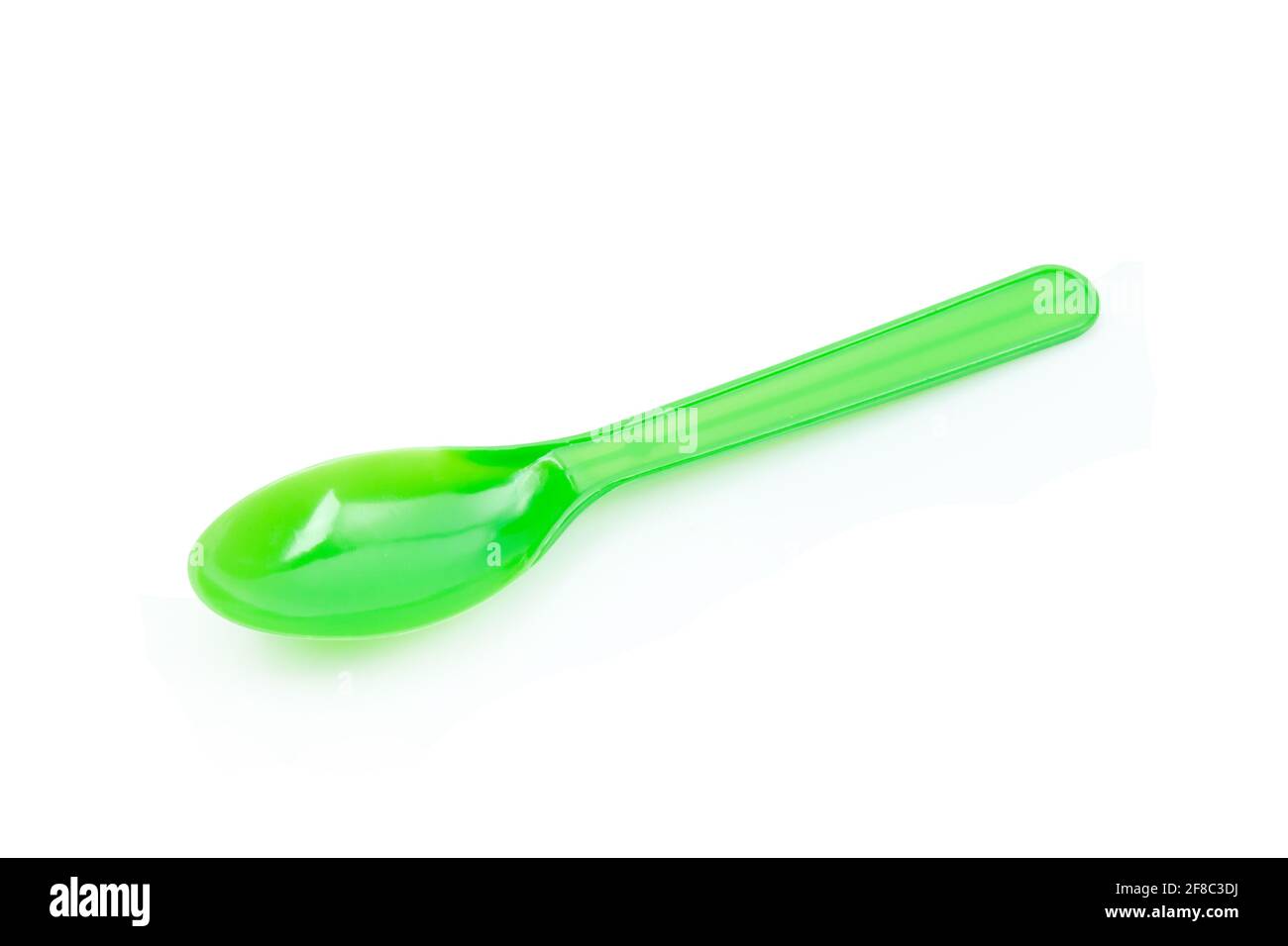 Green plastic spoon isolated on white background Stock Photo - Alamy