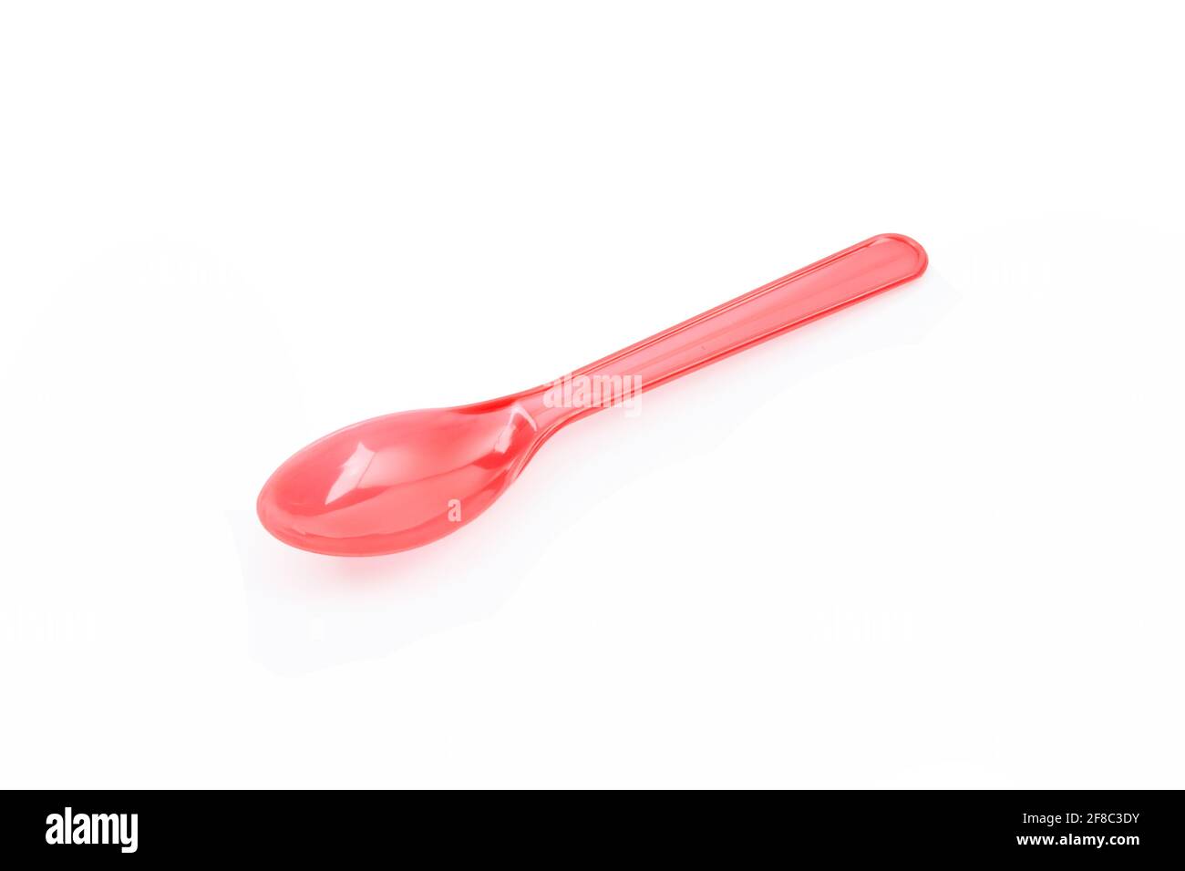 Red plastic spoon isolated on white background Stock Photo - Alamy