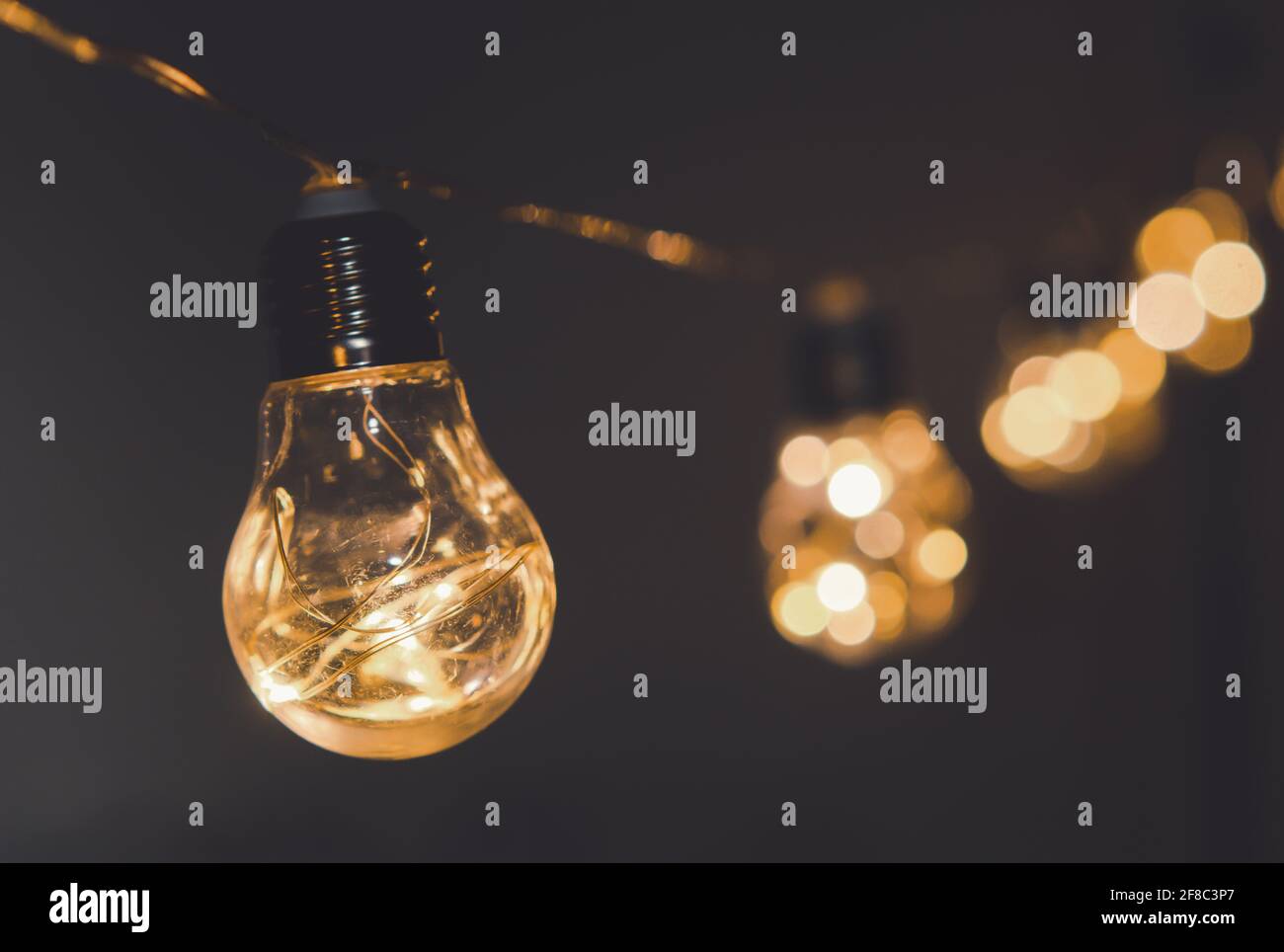 String Light bulbs hanging on a line Stock Photo - Alamy
