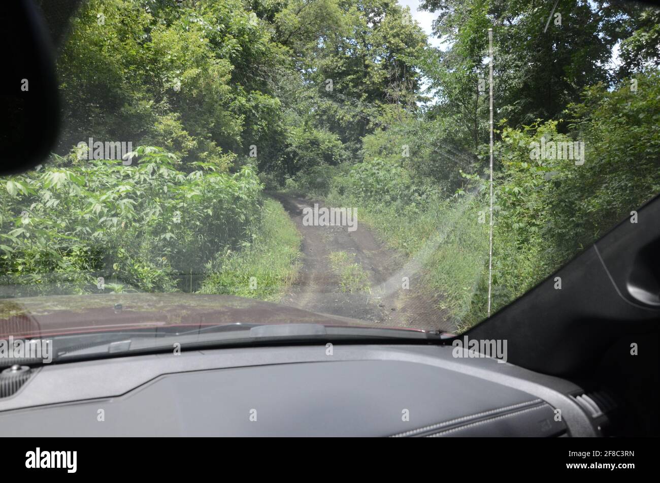 Muddy trail through Jeep windshield Stock Photo - Alamy