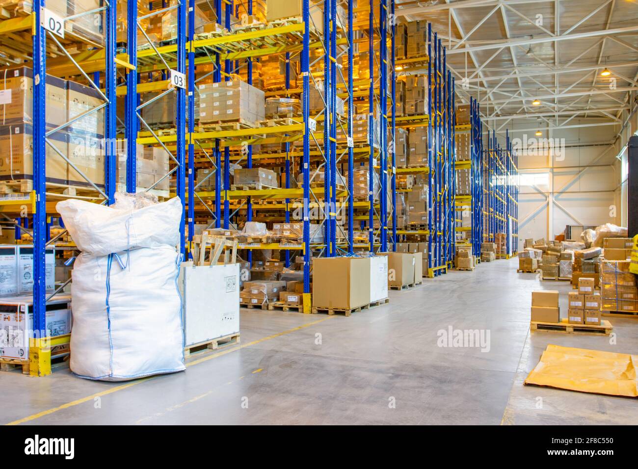 Interior of a modern warehouse storage with rows and goods boxes on ...