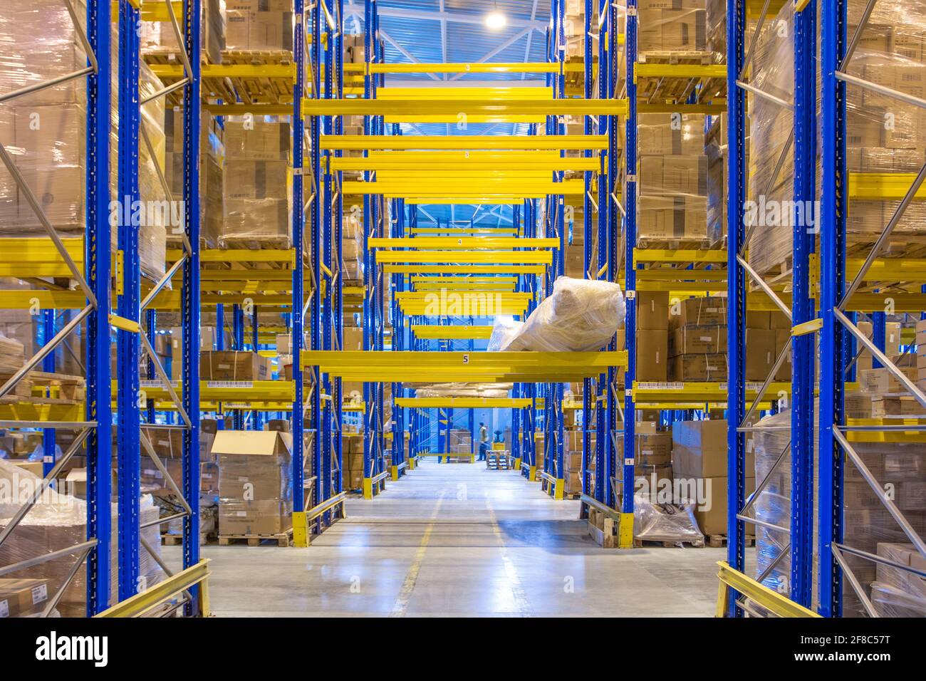 Interior of a modern warehouse storage with rows and goods boxes on ...