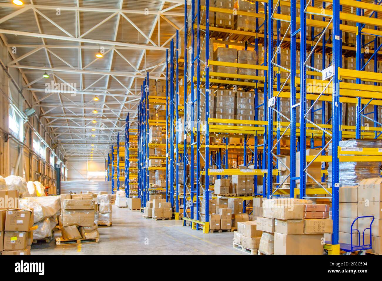 Interior of a modern warehouse storage with rows and goods boxes on ...