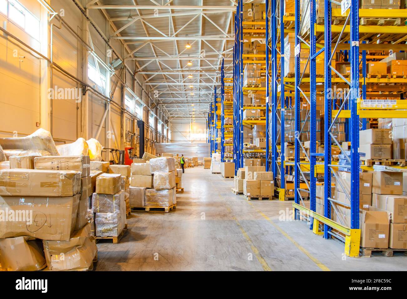Interior of a modern warehouse storage with rows and goods boxes on ...