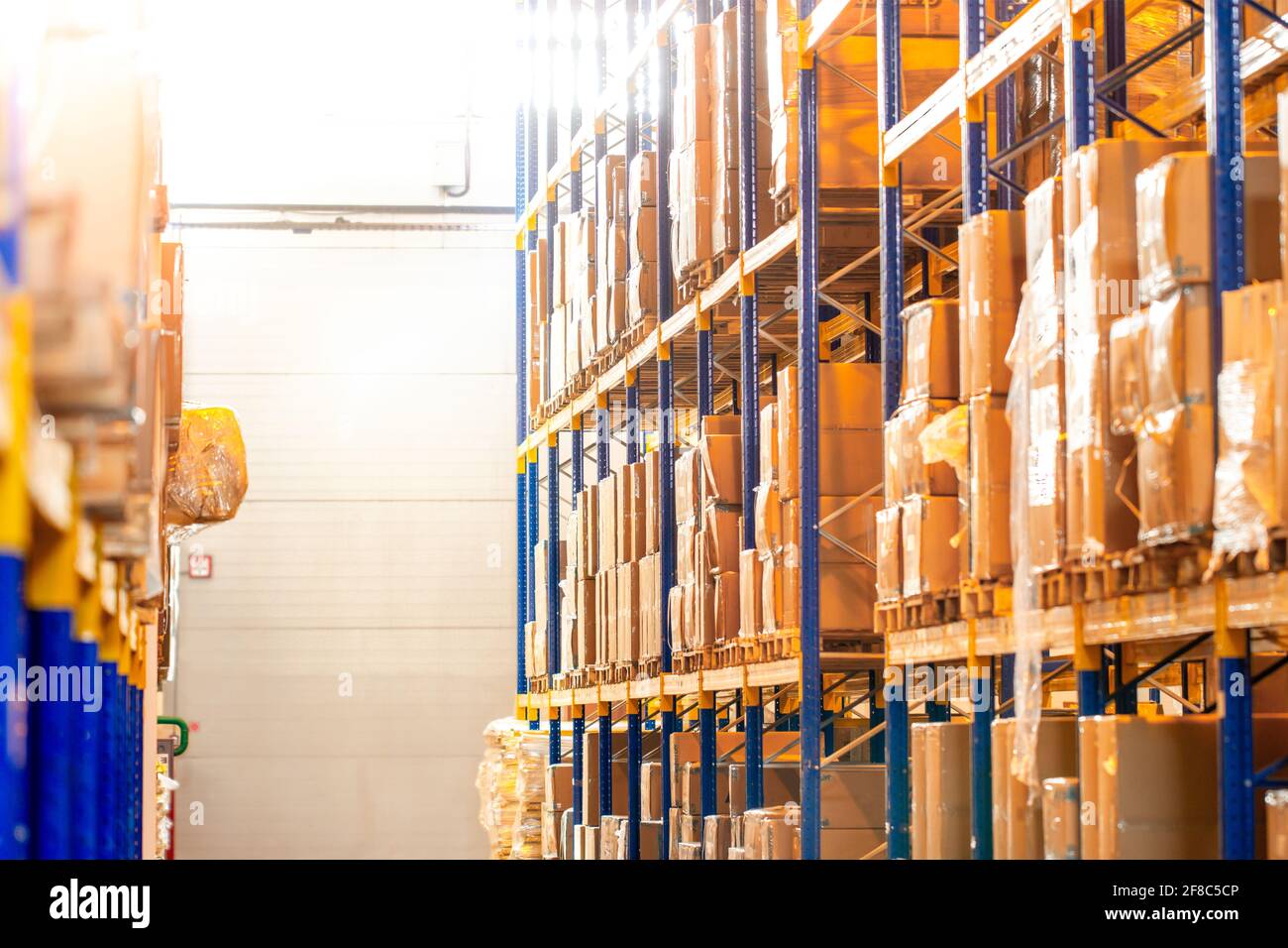 Interior of a modern warehouse storage with rows and goods boxes on ...