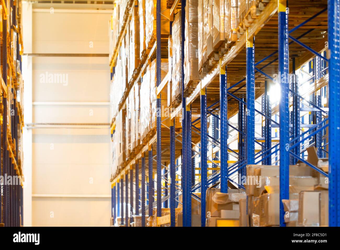 Interior of a modern warehouse storage with rows and goods boxes on ...