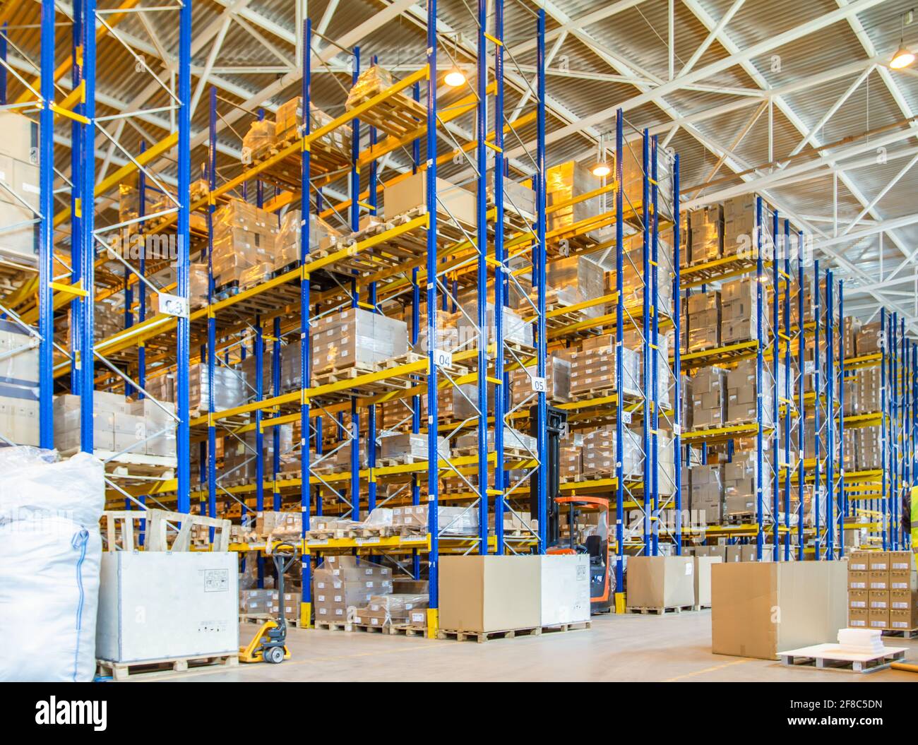 Interior of a modern warehouse storage with rows and goods boxes on ...