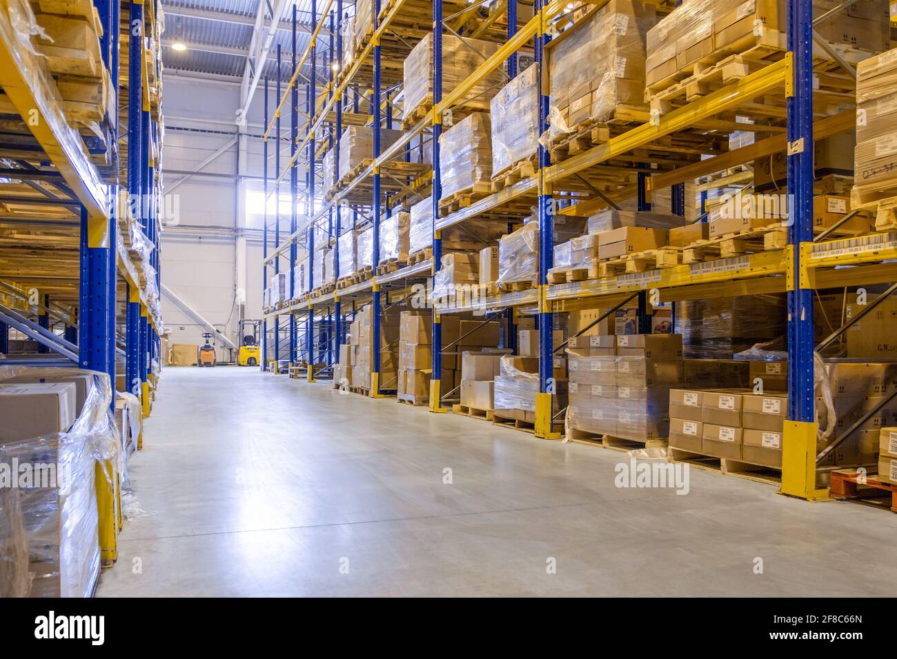 Interior of a modern warehouse storage with rows and goods boxes on ...