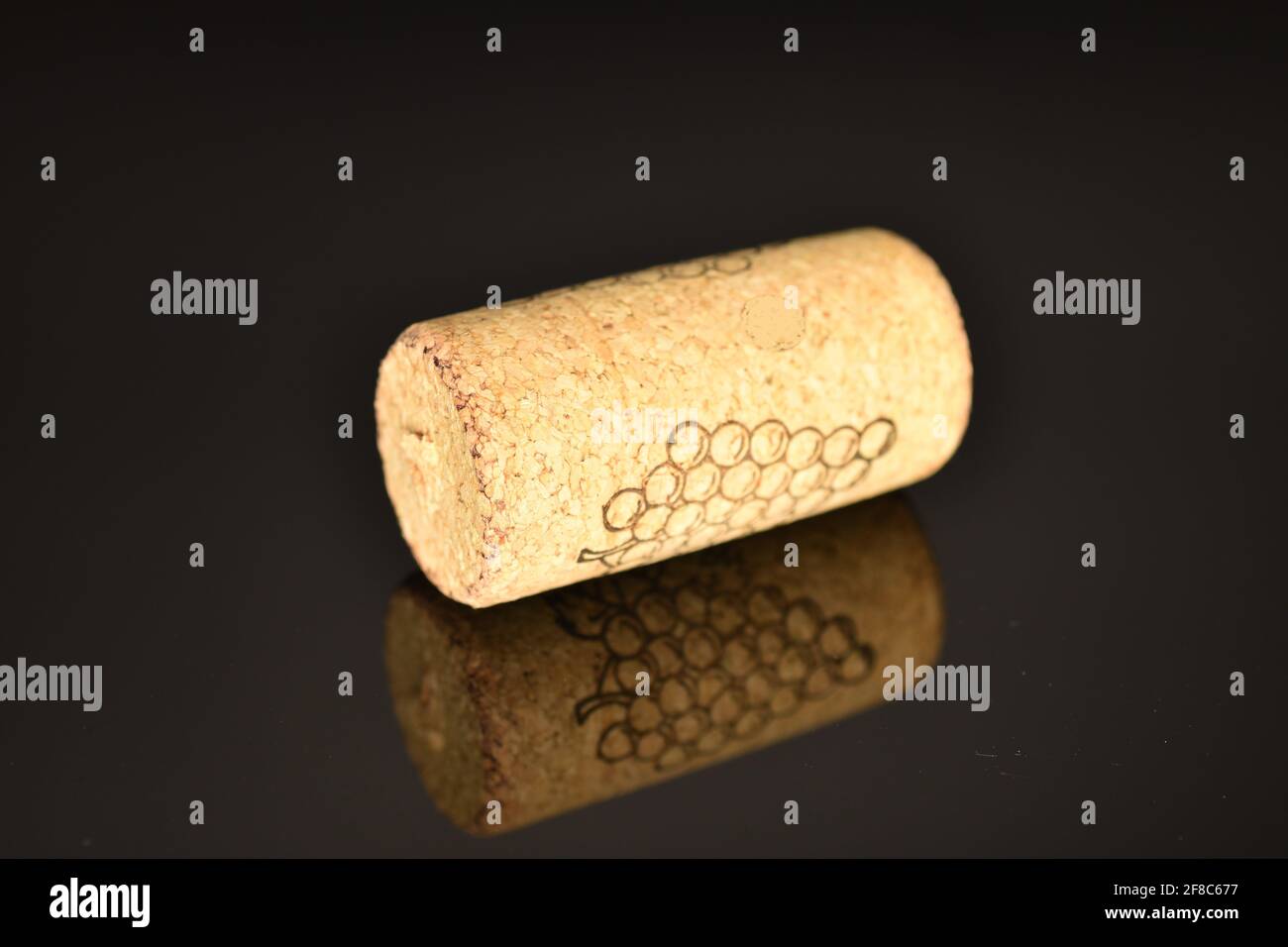 One wine cork, close-up, on a black background Stock Photo - Alamy