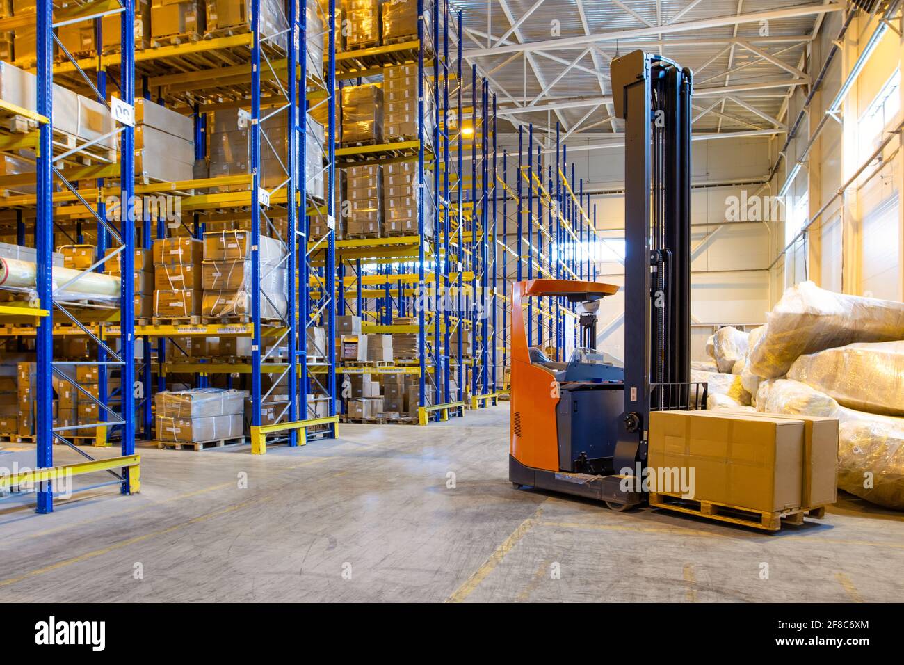 Interior of a modern warehouse storage with rows and goods boxes on ...